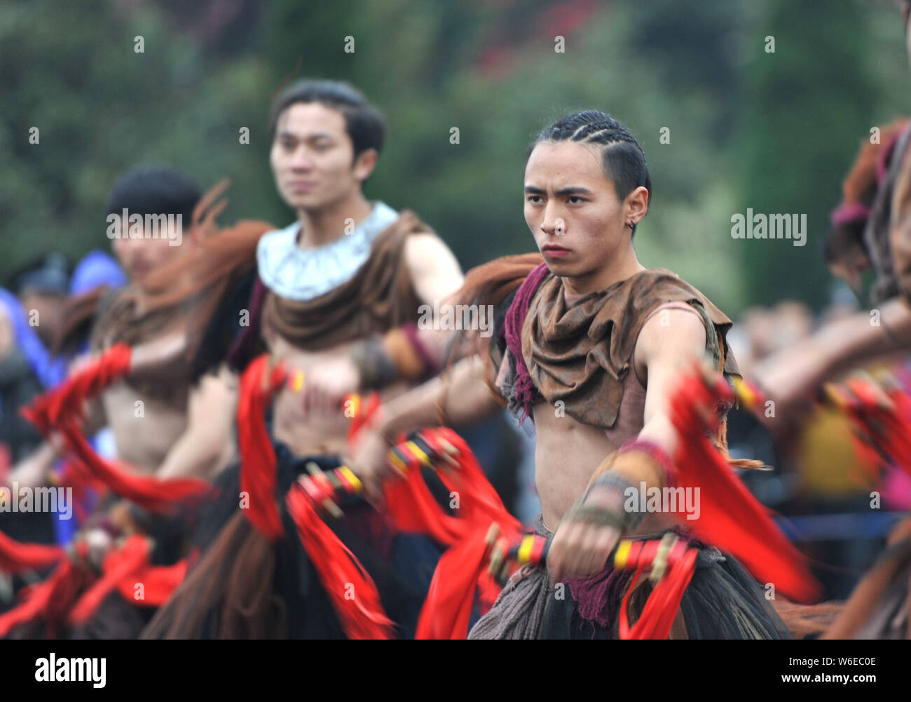 People of Yi ethnic group dressed in traditional Yi costumes pray for ...