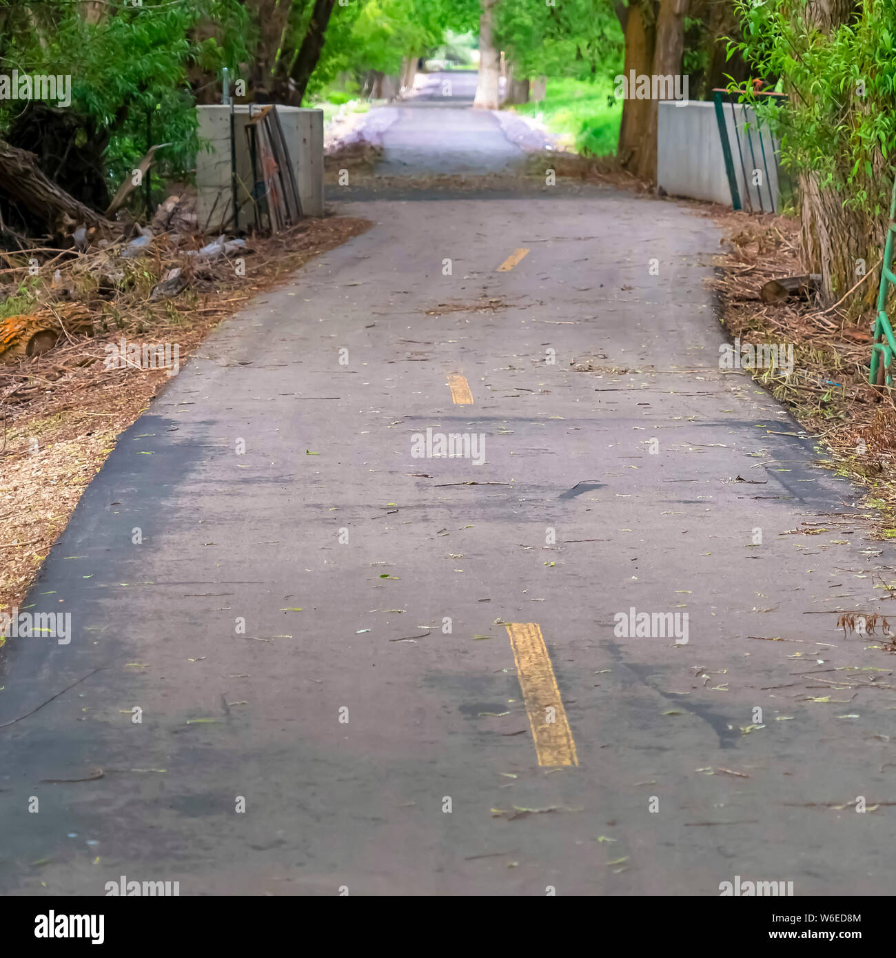 Square frame Close up of paved road with faded yellow lines in the ...