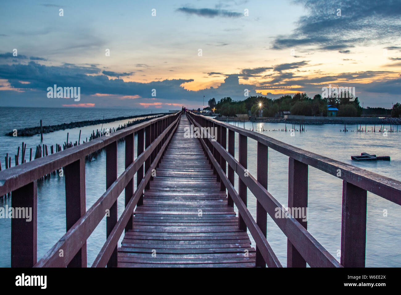 Beautiful of The walkway red wooden bridge in evening at Bang Khun ...