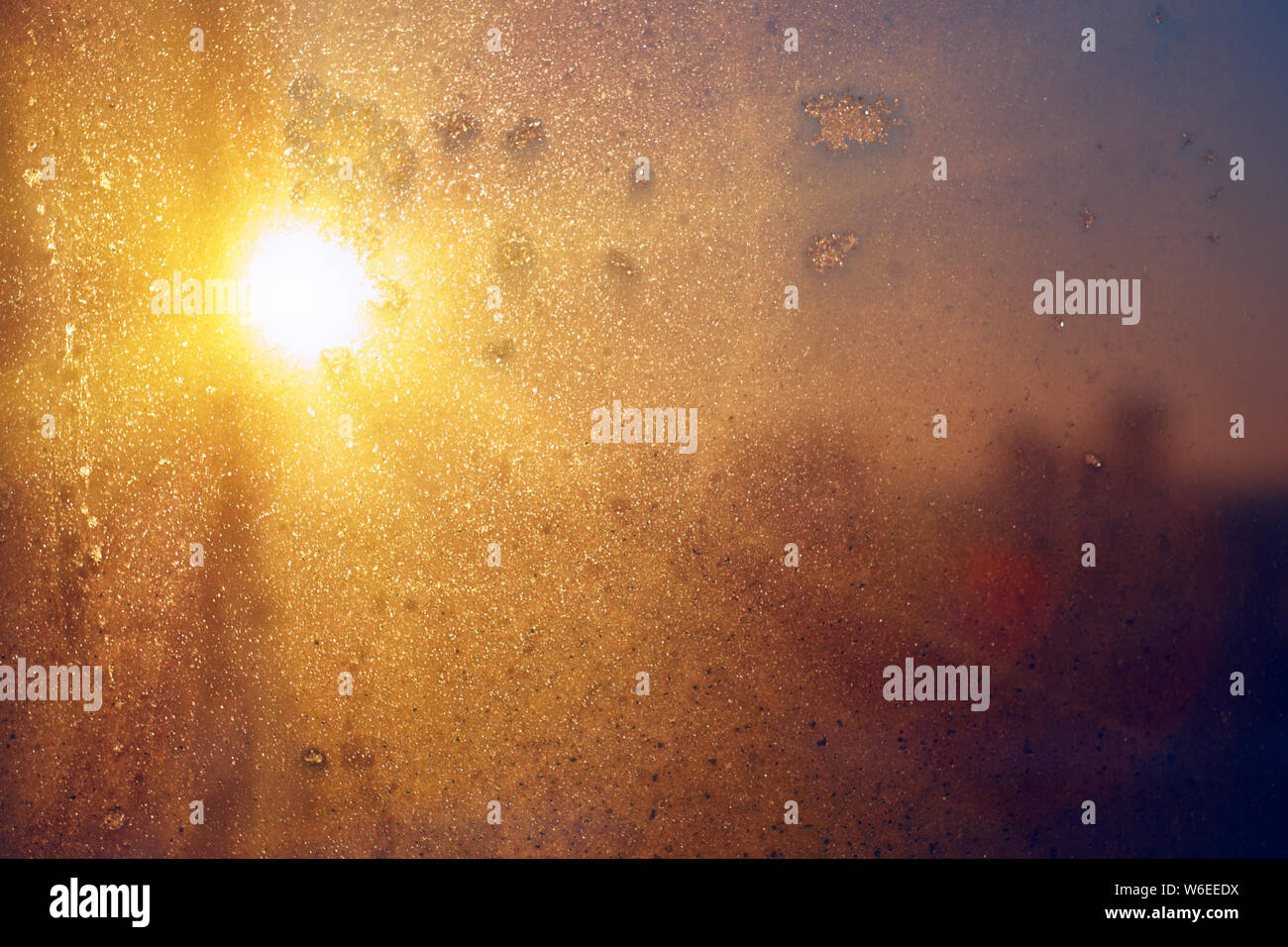 Stunning vintage amber blue sunrise light with blurred cityscape ...
