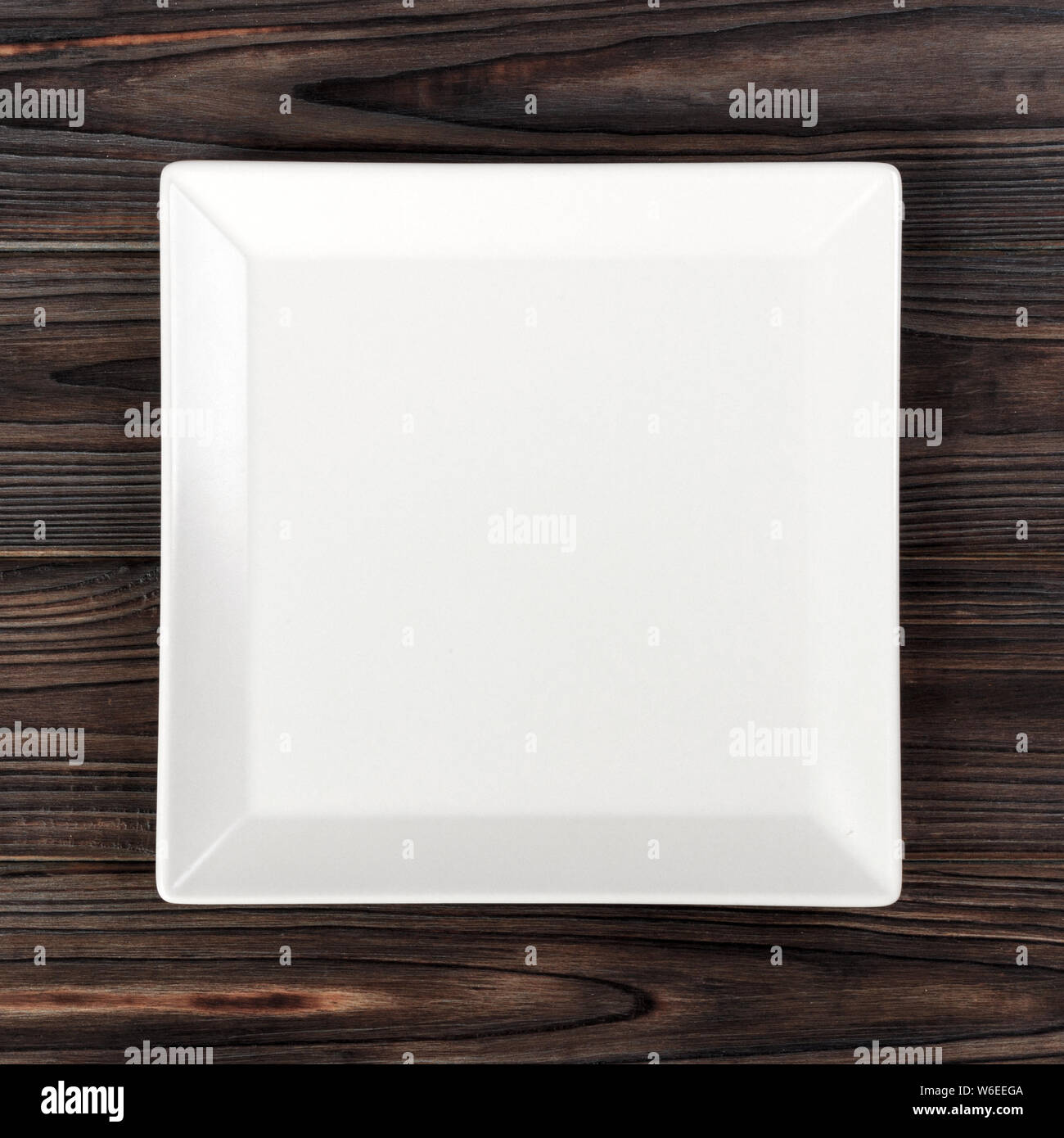 White square Plate on wooden table background. Perspective view Stock ...