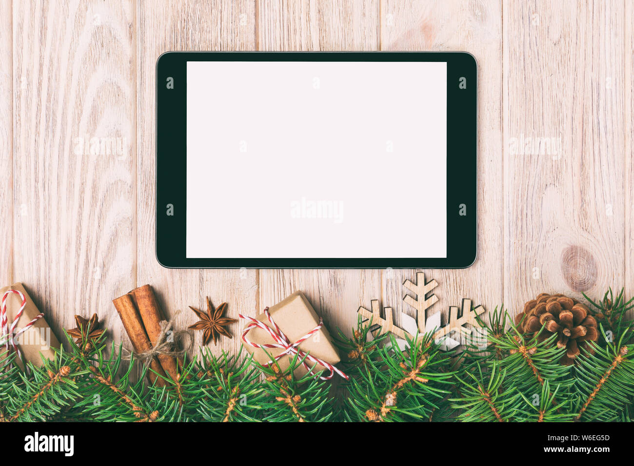 Digital tablet mock up with rustic Christmas wood background ...