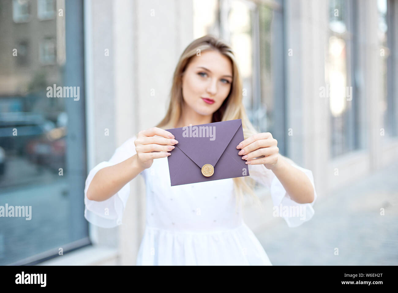Woman invitation smile envelope hi-res stock photography and images - Alamy