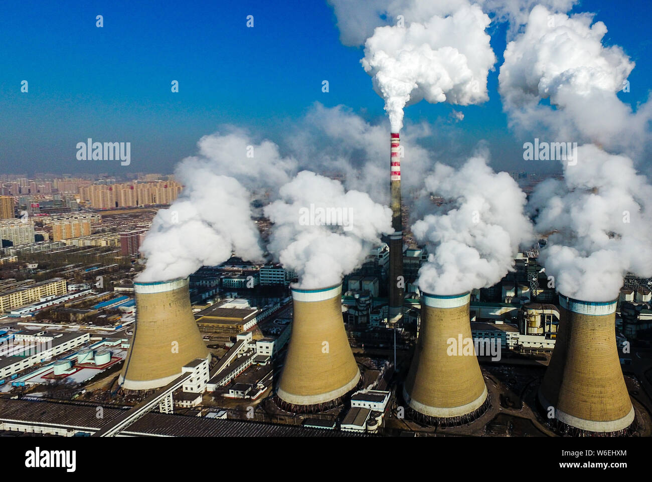 Smoke is discharged from chimneys at a coal-fired power plant of China ...