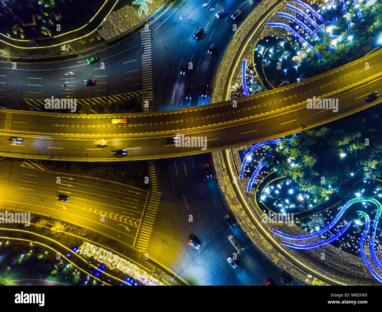 Aerial night view of a roundabout and the nearby roads, resembling the ...
