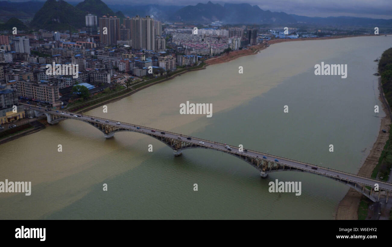 Aerial view of the Rongjiang river divided into two parts after heavy ...