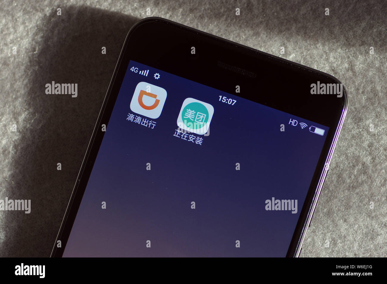 --FILE--View of the icons of the taxi-hailing and car-service app Didi ...