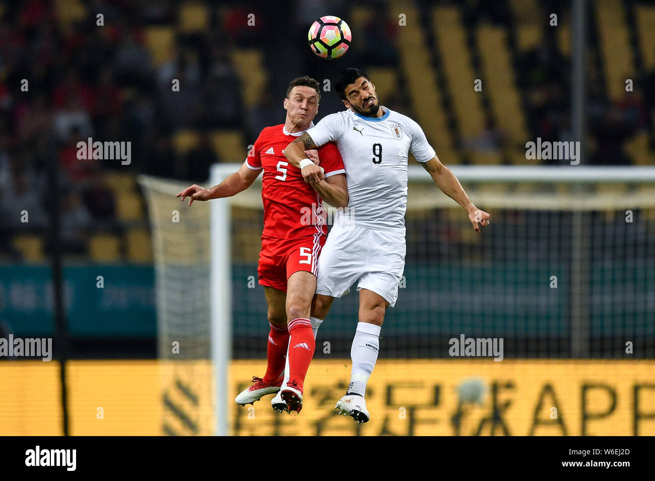 Luis Suarez, top, of Uruguay national football team heads the ball to ...