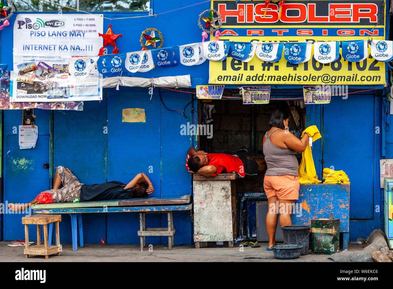 Women Do All The Work, Cebu City, Cebu, The Philippines Stock Photo - Alamy