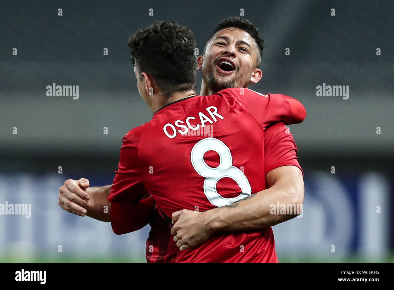 Brazilian football player Oscar, front, of China's Shanghai SIPG FC, celebrates with his ...