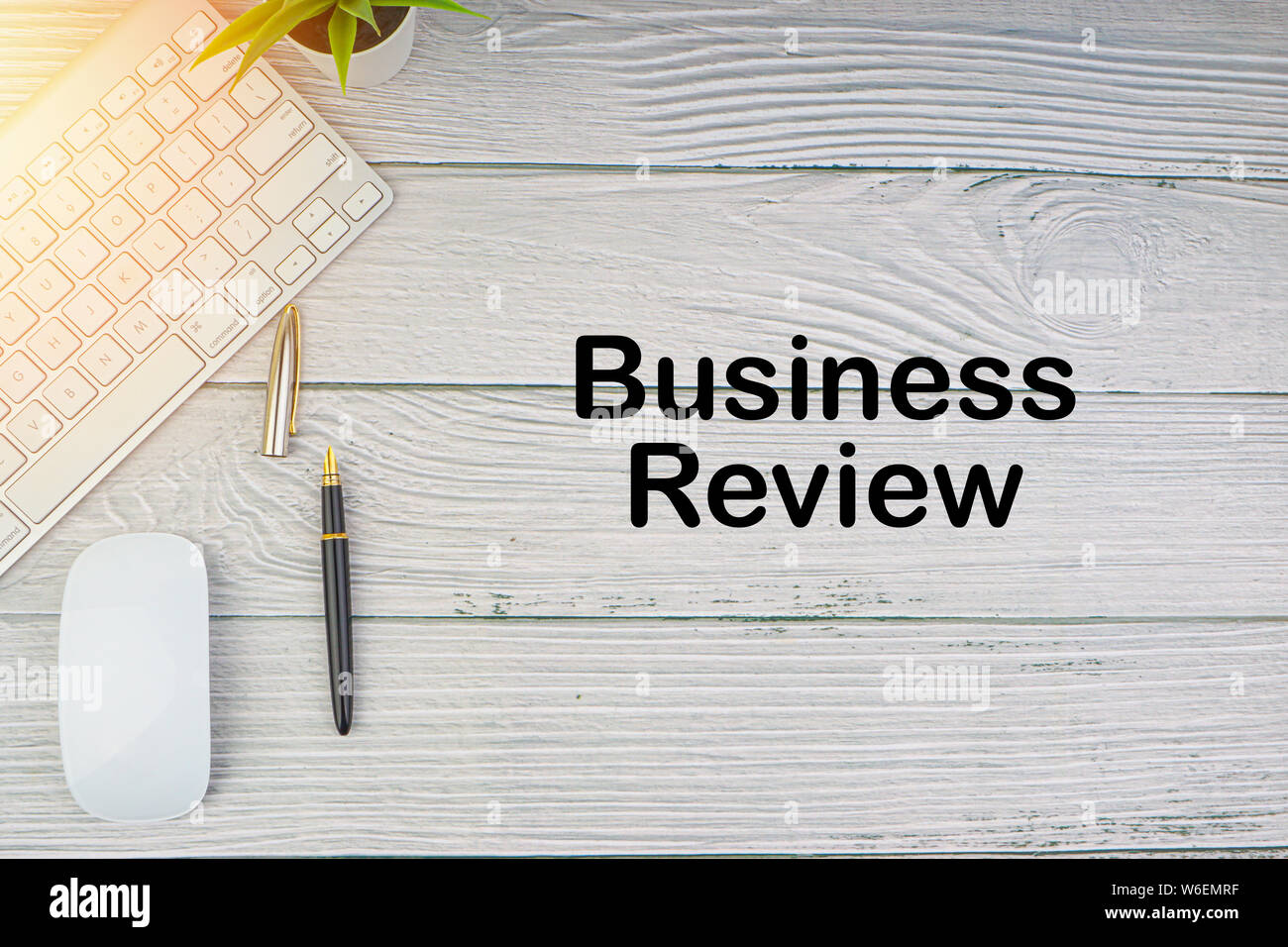 Flat lay, top view office table desk. Workspace with BUSINESS REVIEW ...