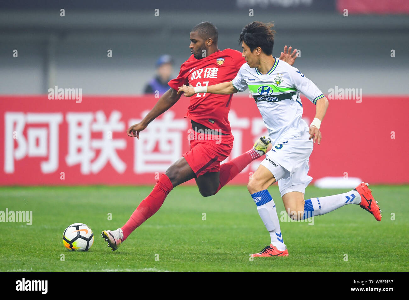 French soccer player Anthony Modeste, left, of China's Tianjin Quanjian ...