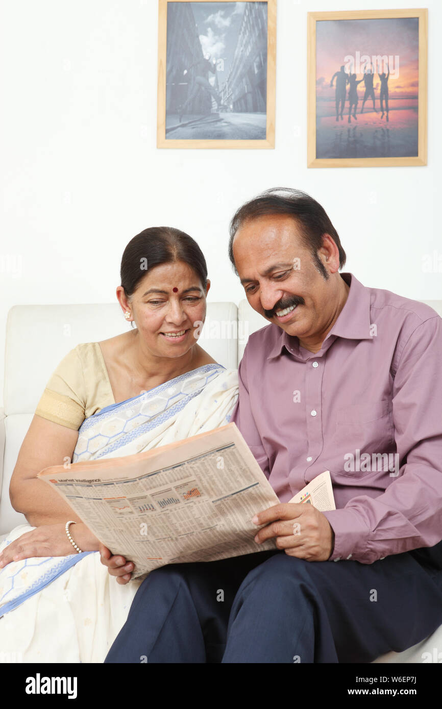 Sharing newspaper hi-res stock photography and images - Alamy