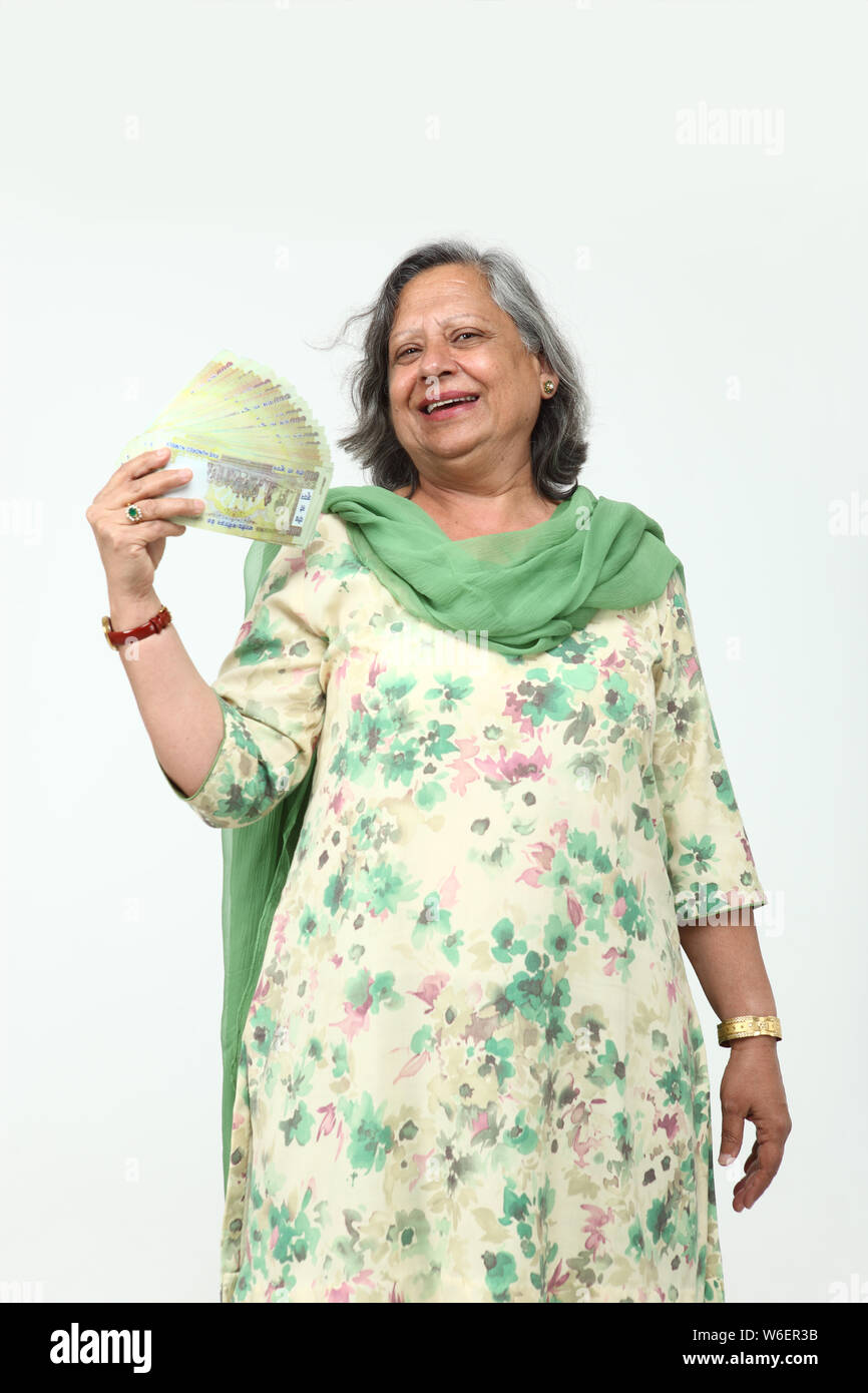 Woman with banknotes hi-res stock photography and images - Alamy