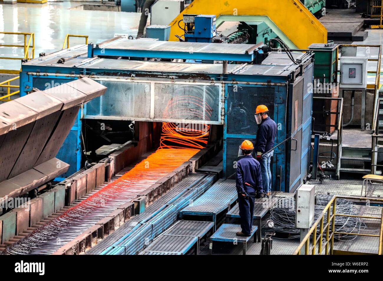 --FILE--Chinese workers survey the production of steel at a plant of ...