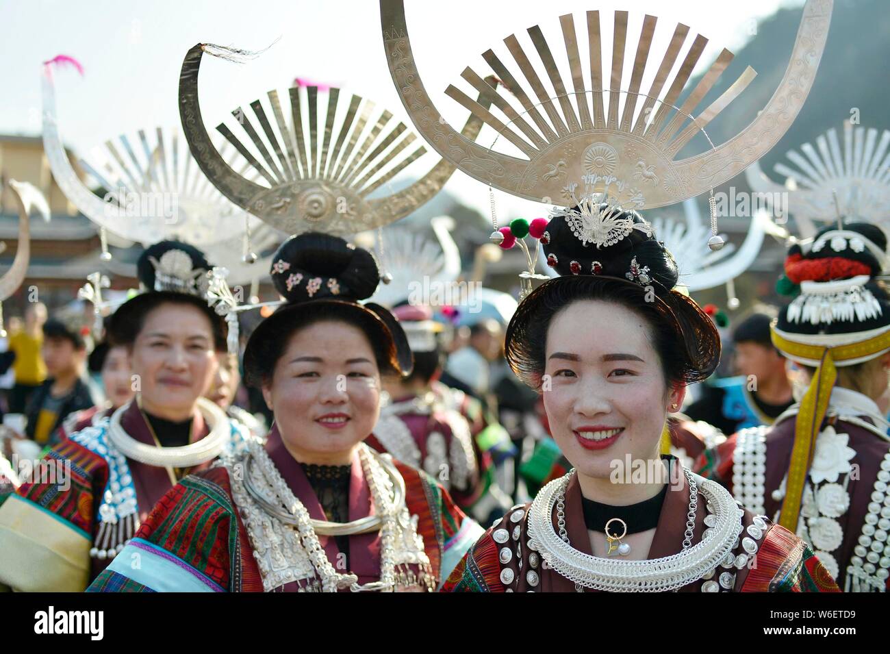 Chinese girls of Miao ethnic minority dressed in traditional silver ...