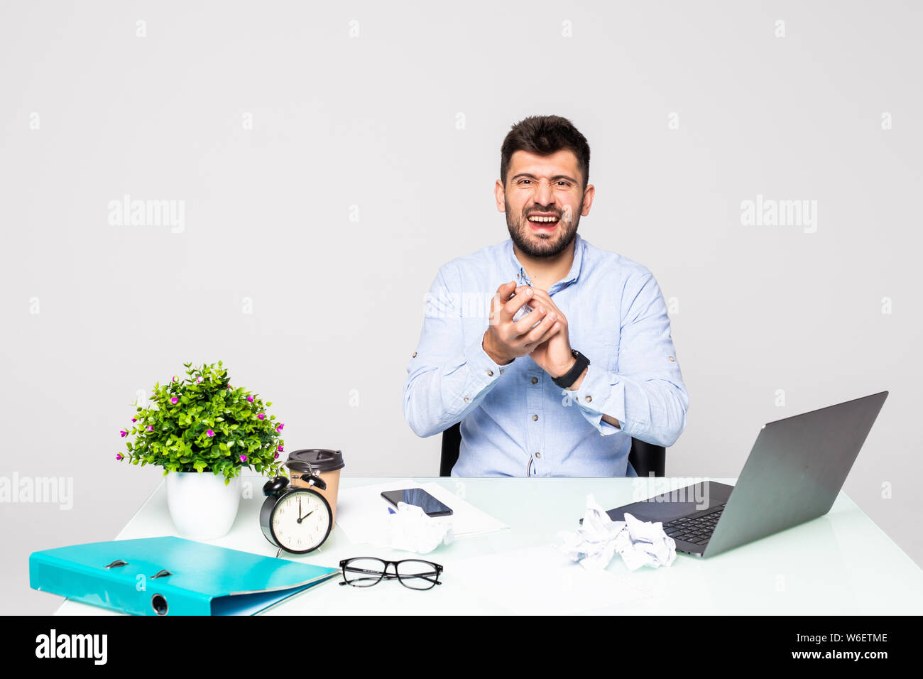 Angry businessman in glasses with beard yelling and crumpling paper on ...