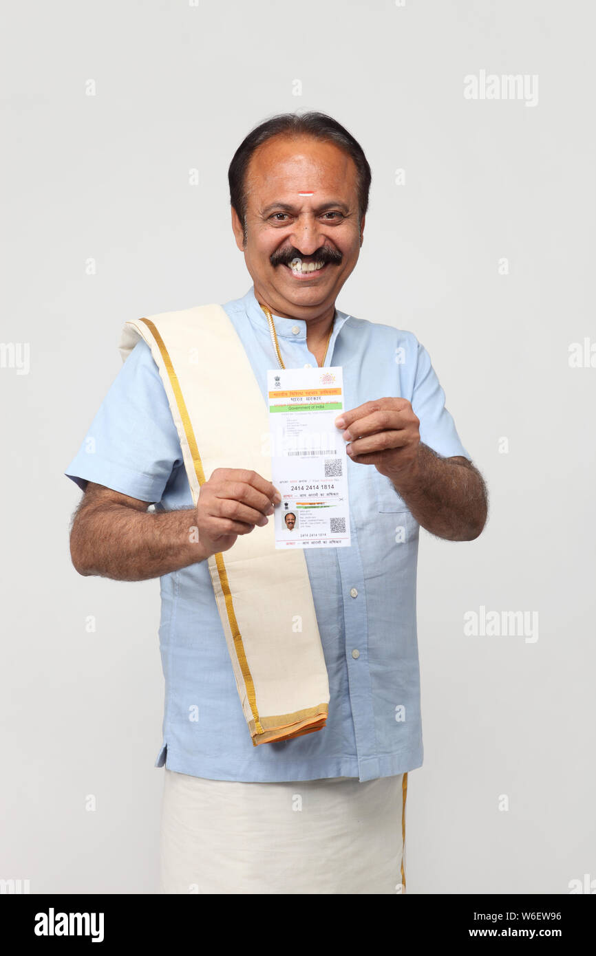 South Indian man showing an Aadhar card Stock Photo - Alamy