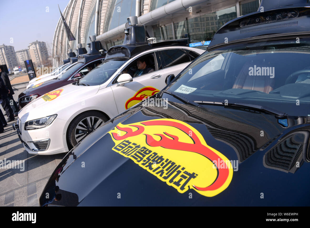 Self-driving cars of Baidu are lined up during a license issuing ...