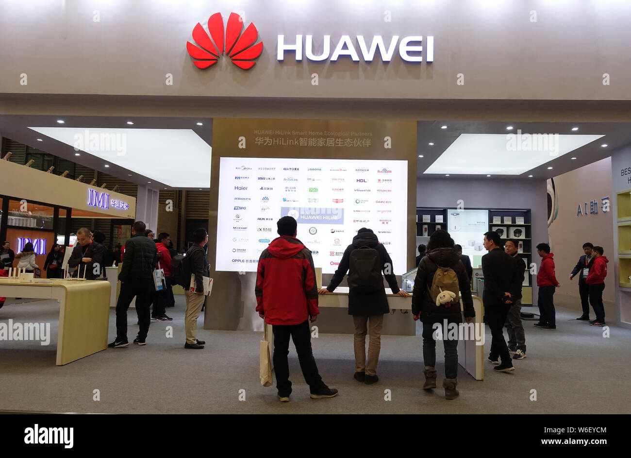 --FILE--People visit the stand of Huawei during an exhibition in ...