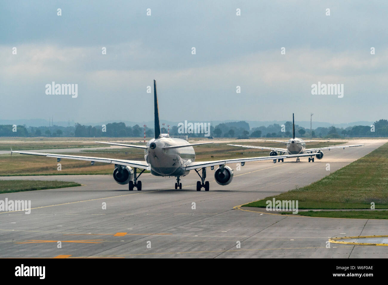 Airplane while rolling in runaway before take off Stock Photo - Alamy