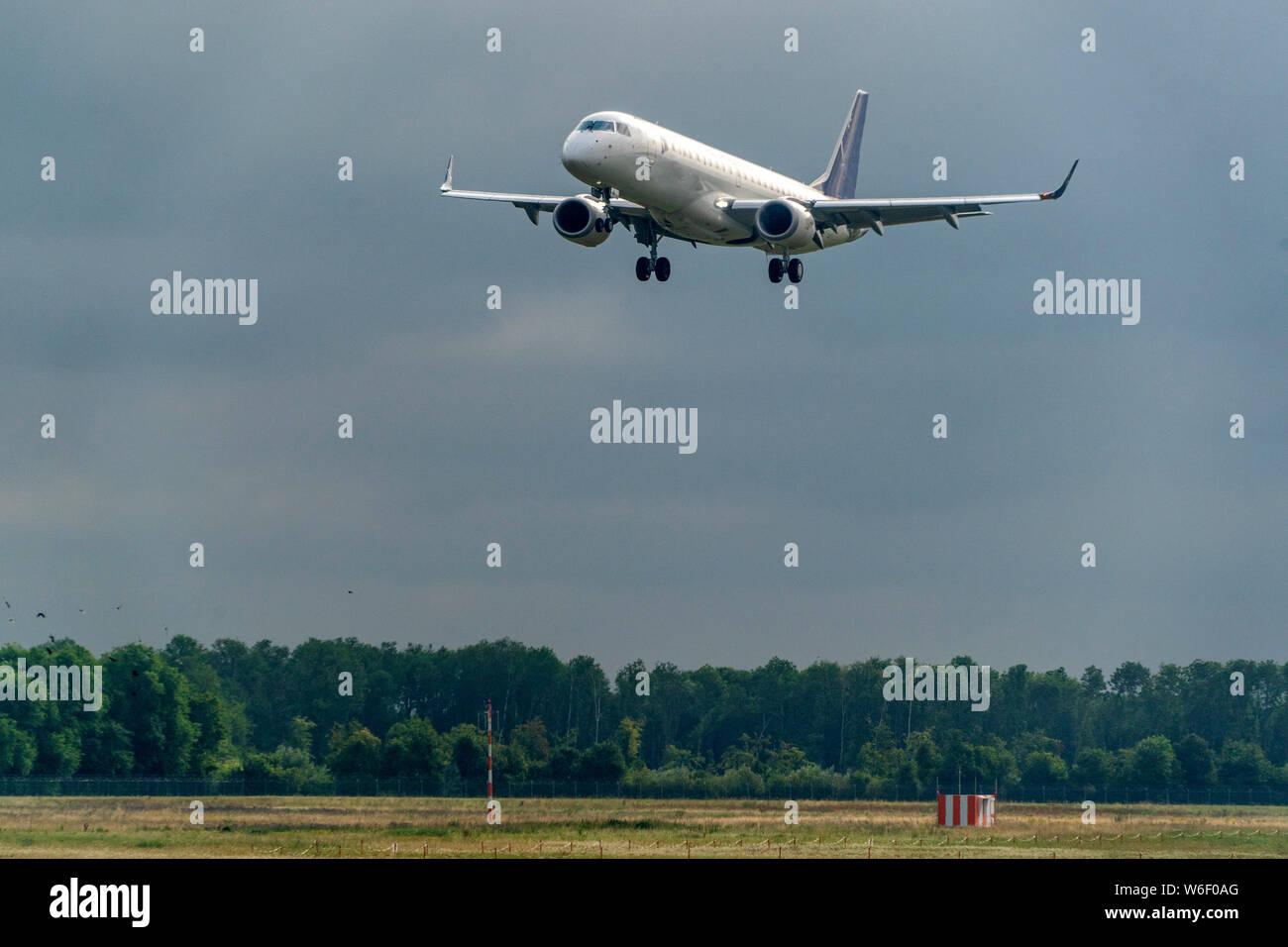 Airplane while rolling in runaway before take off Stock Photo - Alamy