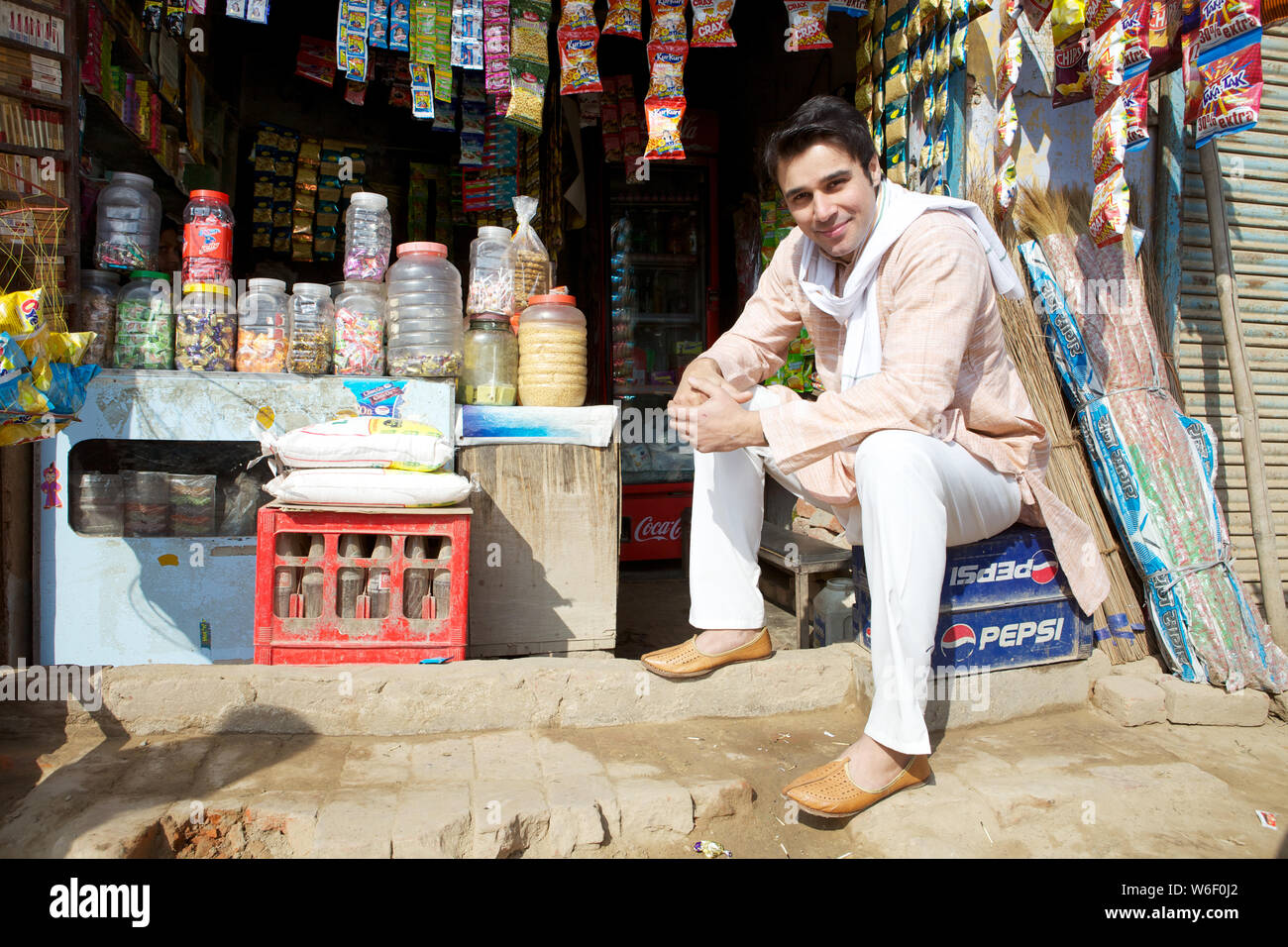 Shopkeeper in grocery shop Stock Photo - Alamy