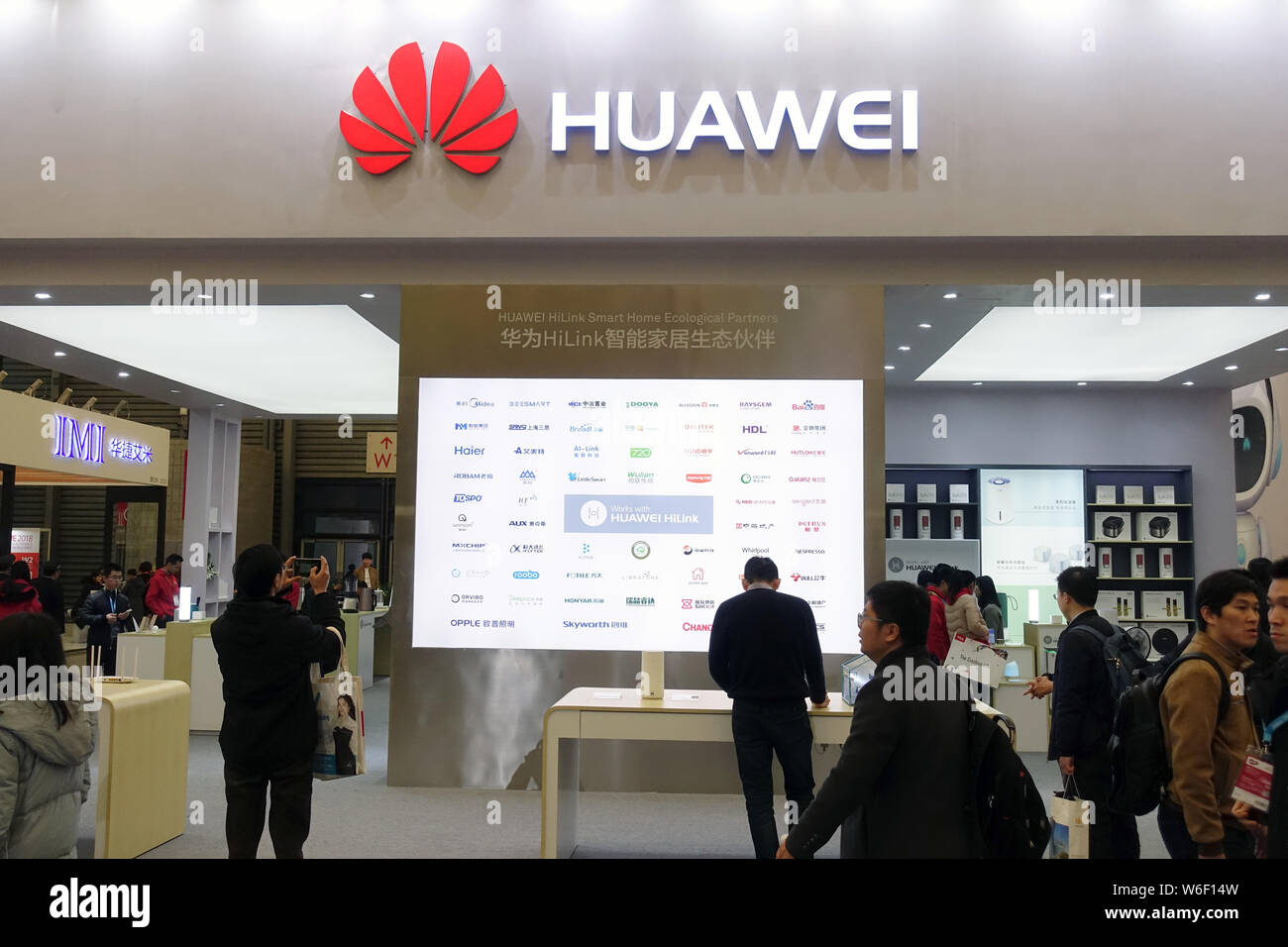 --FILE--People visit the stand of Huawei during an exhibition in ...