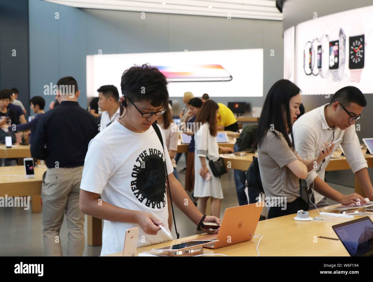 --FILE--Customers try out MacBook laptop computers at an Apple Store in ...