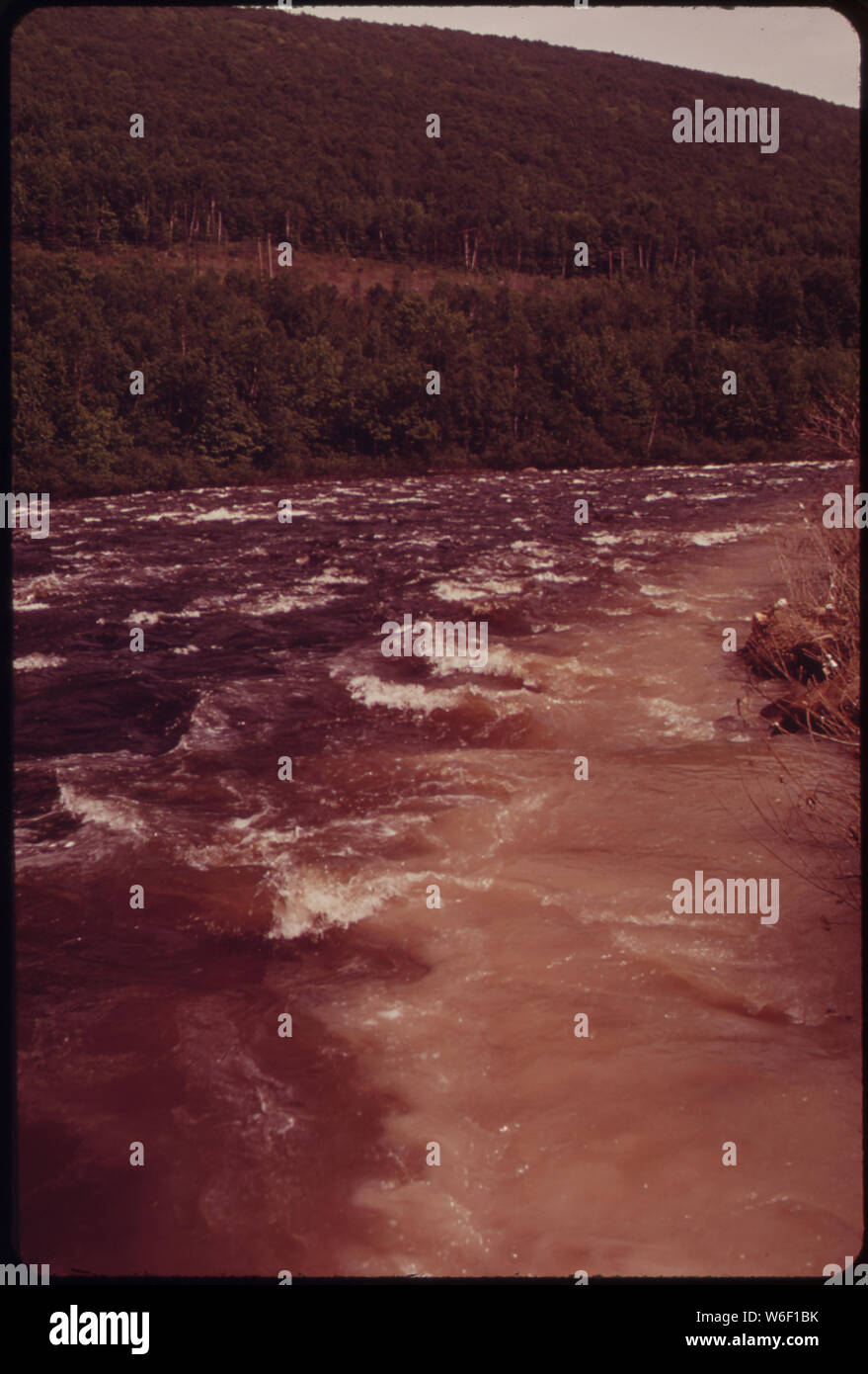 ANDROSCOGGIN RIVER SHOWING OUTFLOW FROM THE PAPER MILL AT CASCADE Stock ...
