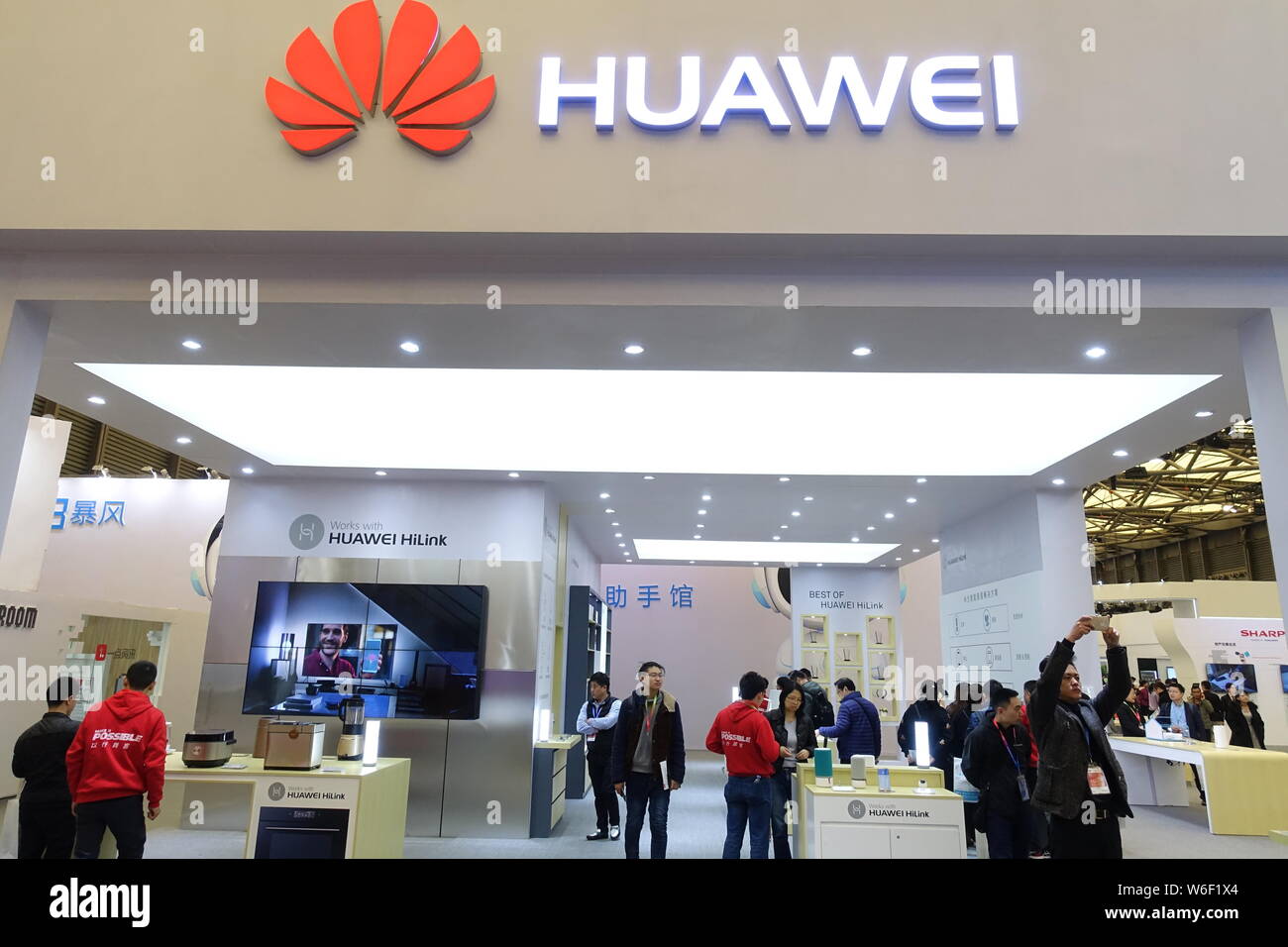 --FILE--People visit the stand of Huawei during an exhibition in ...