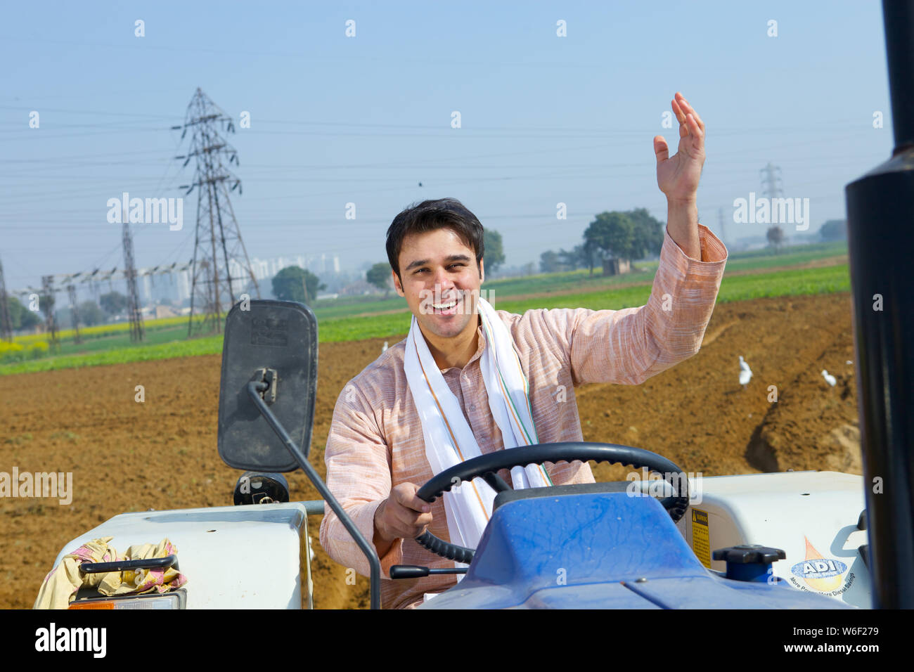 Farmer ploughing field Stock Photo - Alamy