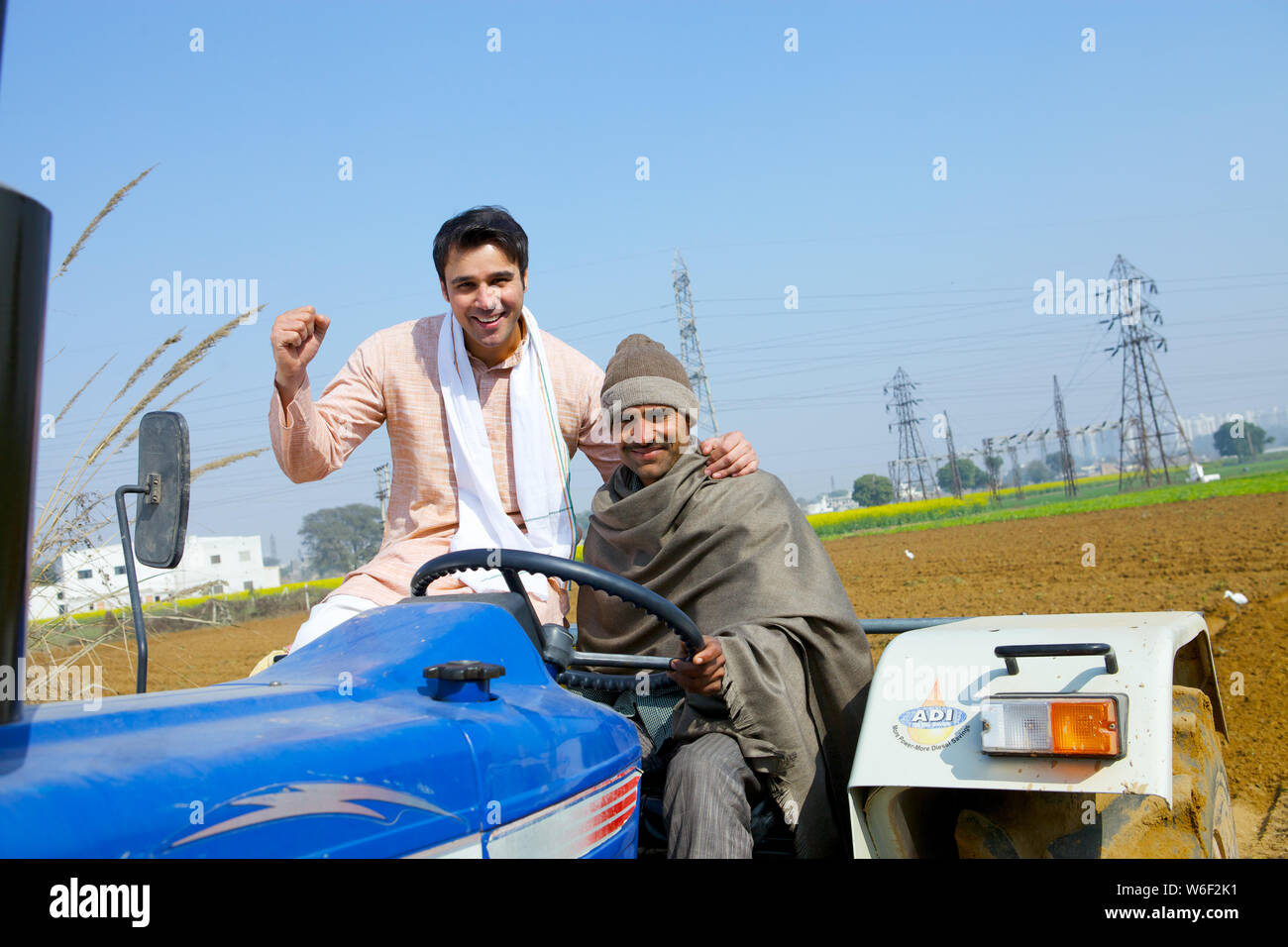 Farmer ploughing field Stock Photo - Alamy
