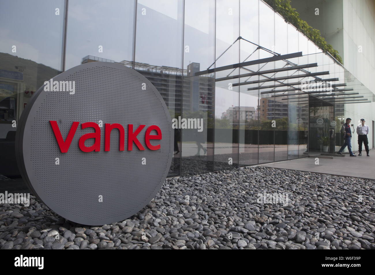 --FILE--A logo of Vanke is pictured in front of the headquarters of ...