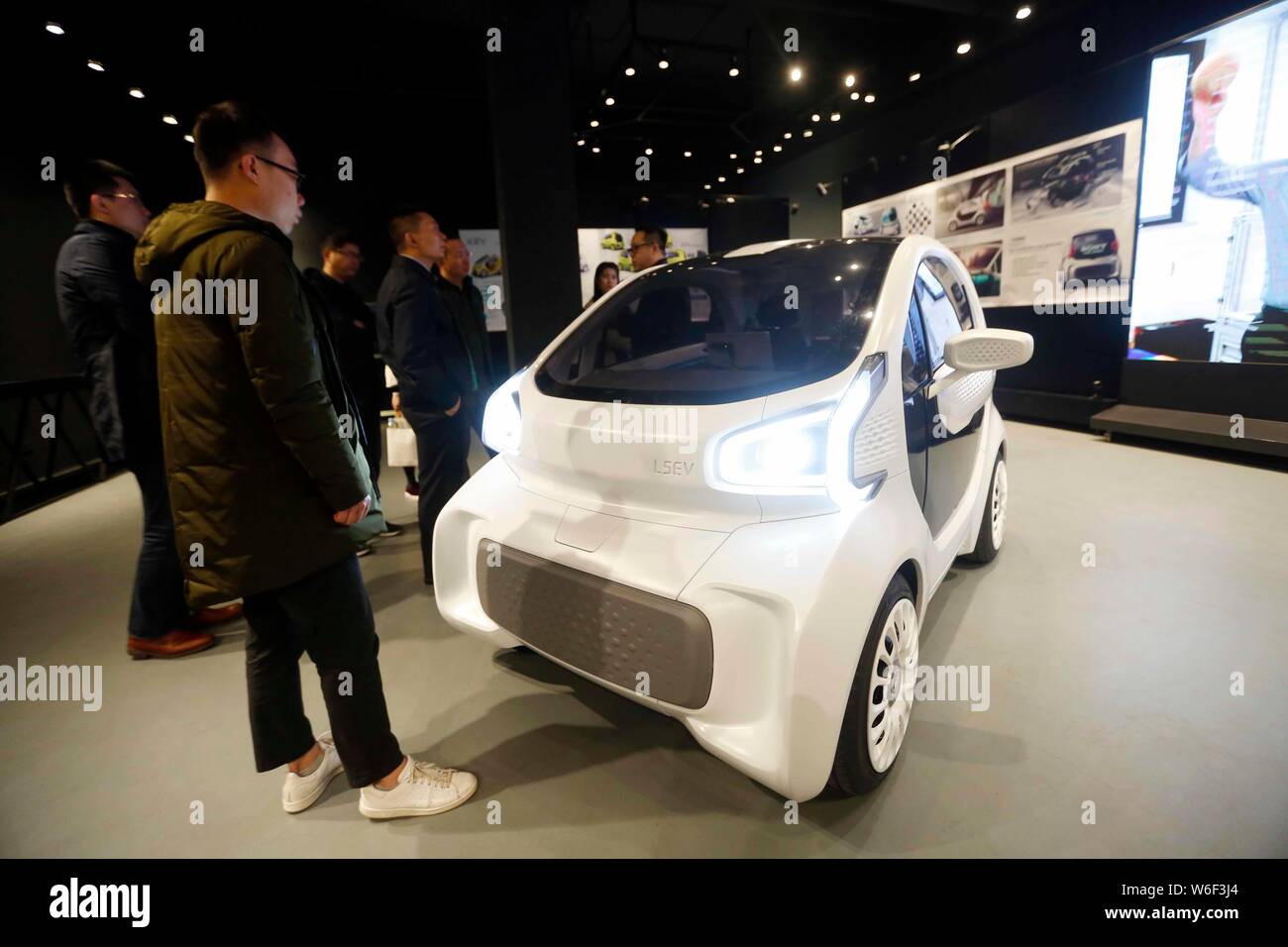Visitors look at a 3D-printed LSEV electric car of Italy-based X ...