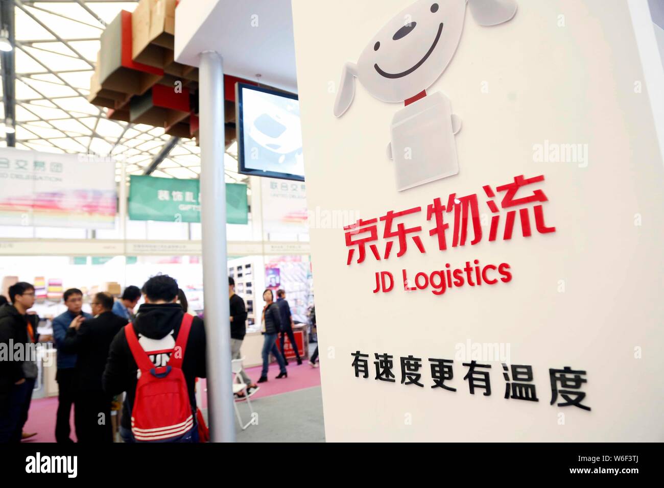 People visit the stand of JD Logistics of Chinese online retailer JD ...