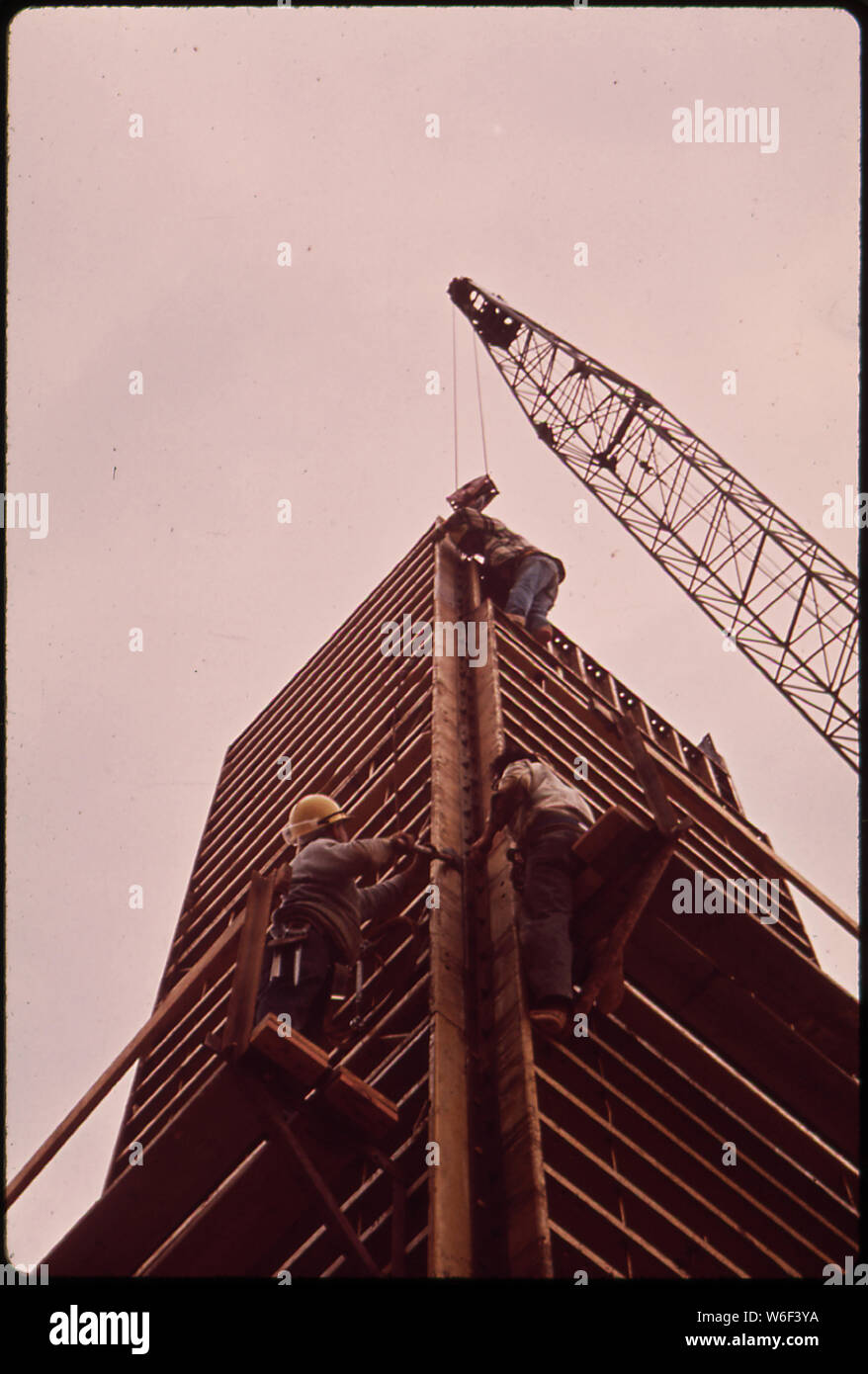 AT WORK ON THE SUPPORTS OF A NEW BRIDGE. THIS BRIDGE WILL COMPLETE THE ...