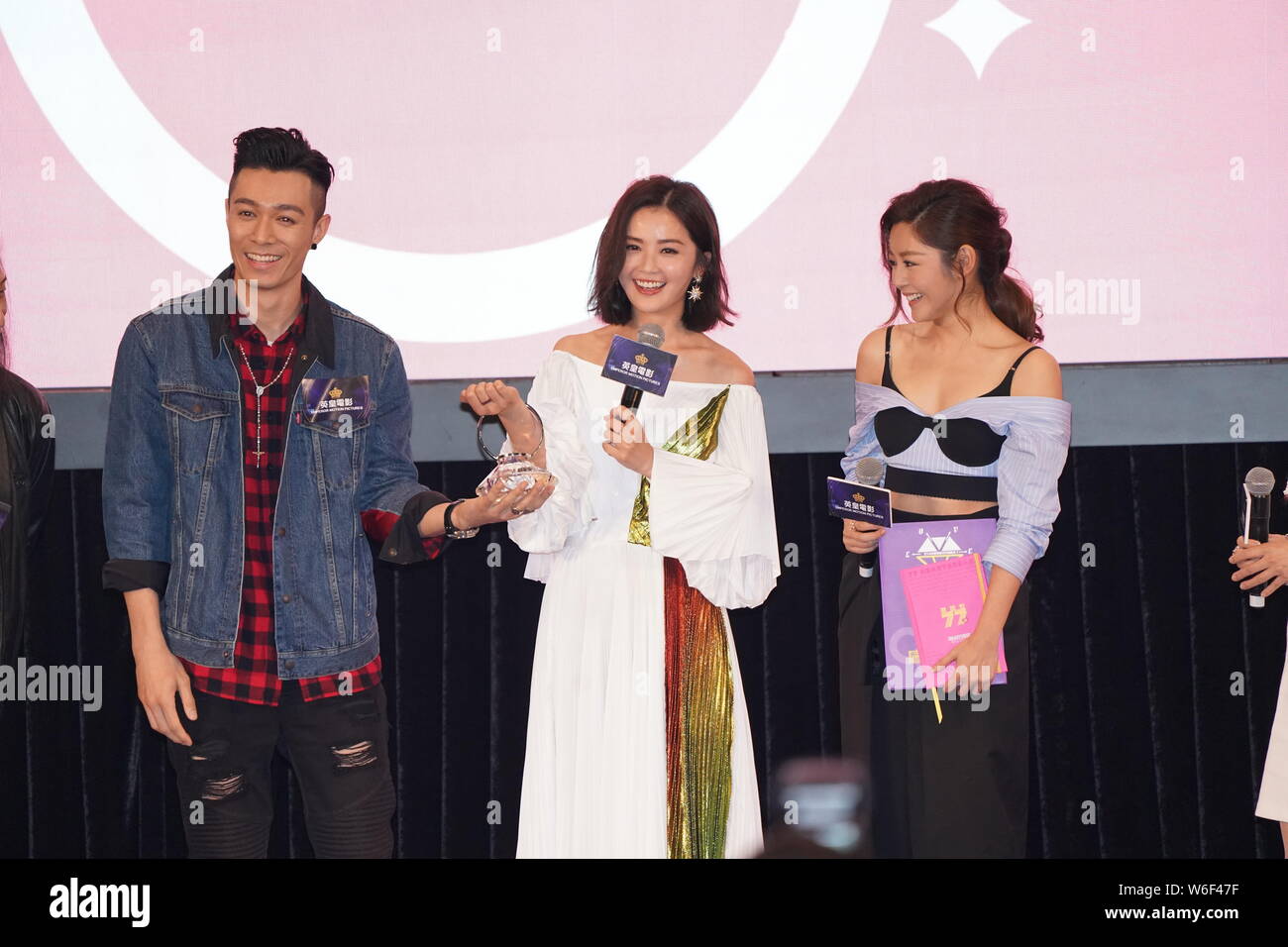 Singer and actress Charlene Choi of Hong Kong pop duo Twins, center ...