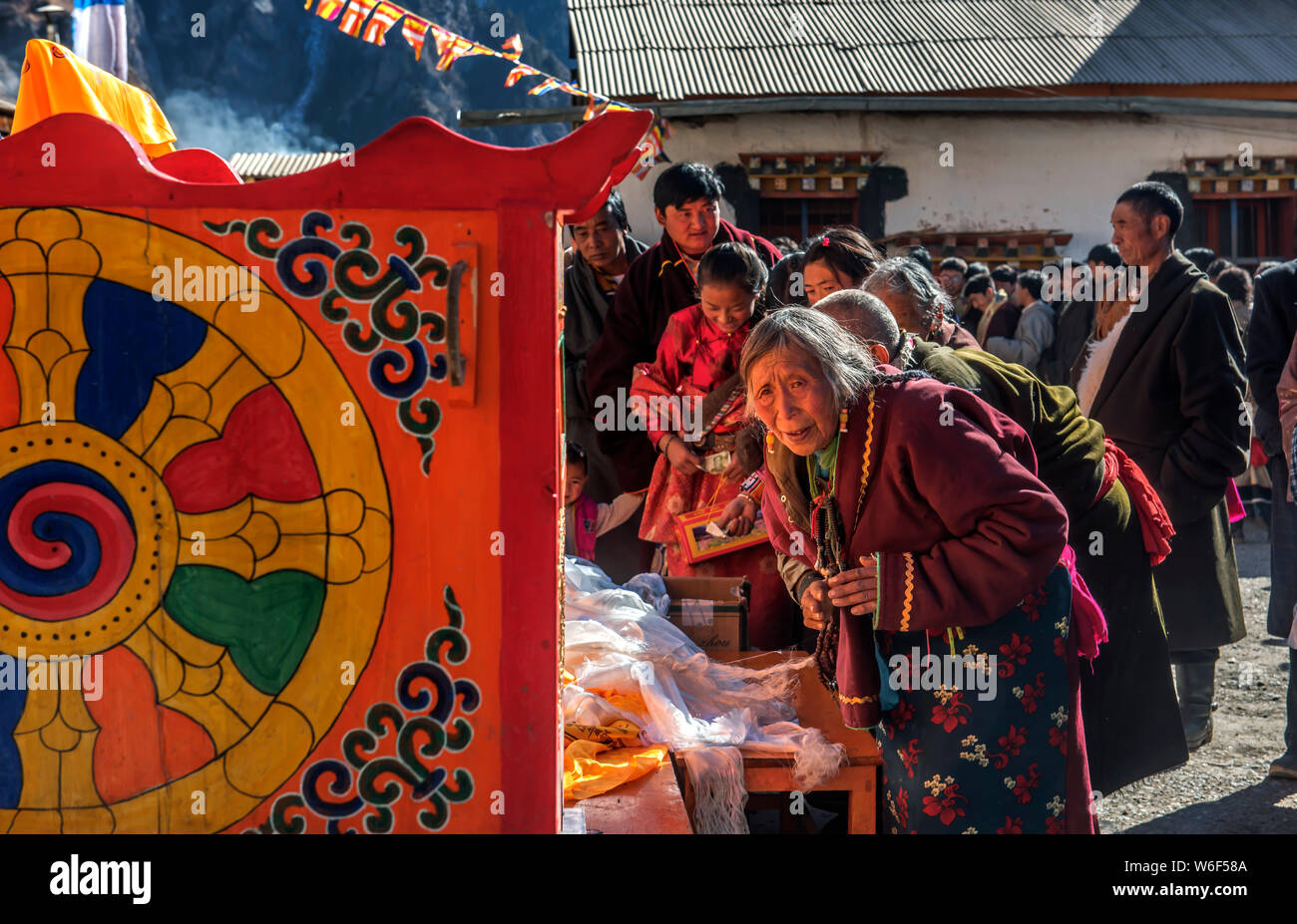 --FILE--Local residents shop for goods during a sacrifice rite to pray ...