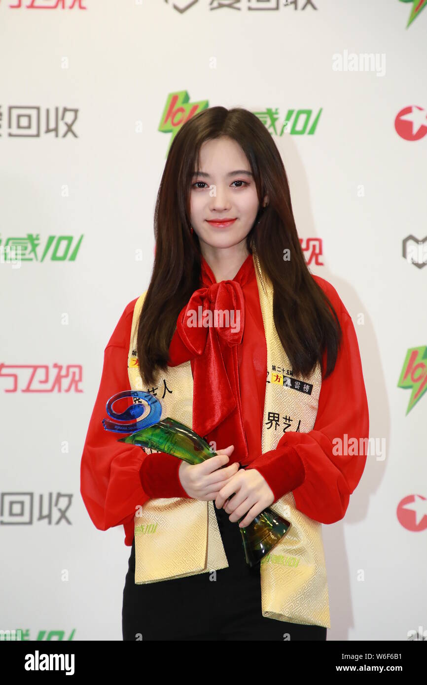 Chinese singer and actress Ju Jingyi poses with her trophy backstage ...