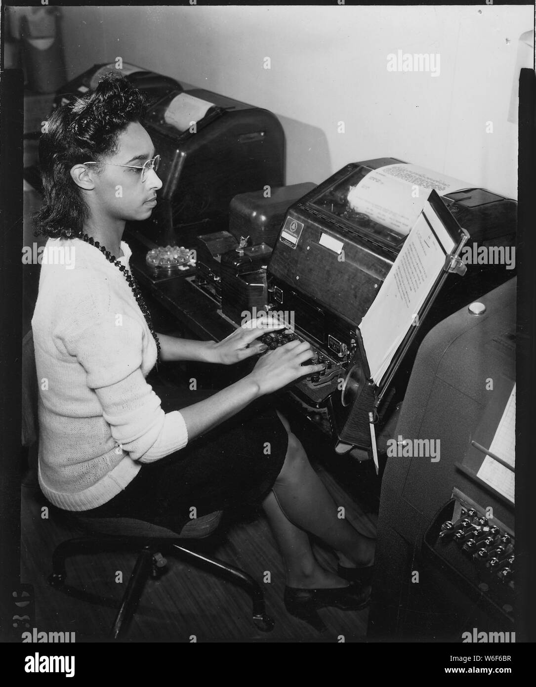 [African-American woman] teletype operator Stock Photo - Alamy