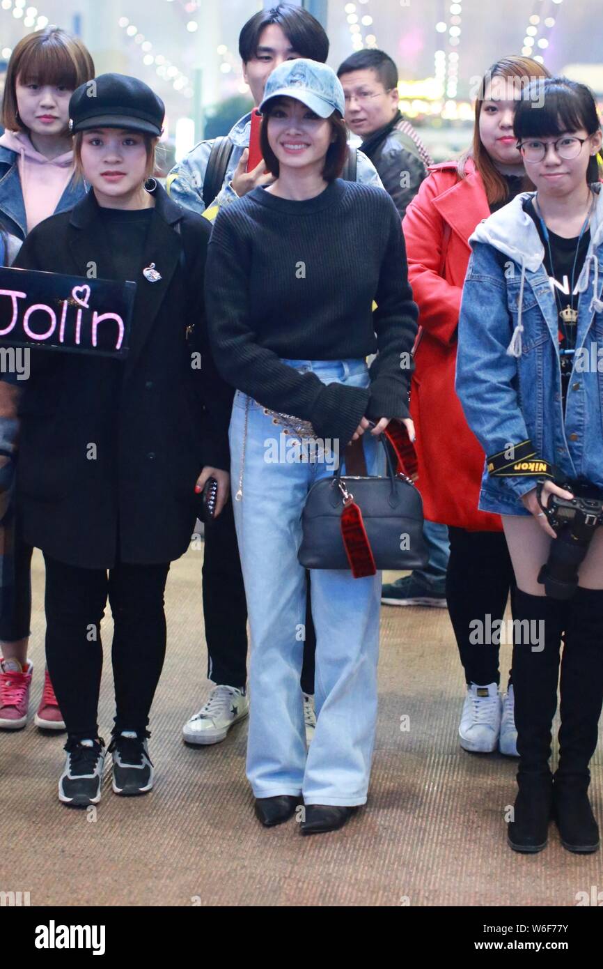 Taiwanese singer Jolin Tsai, center, poses for photos with fans as she ...