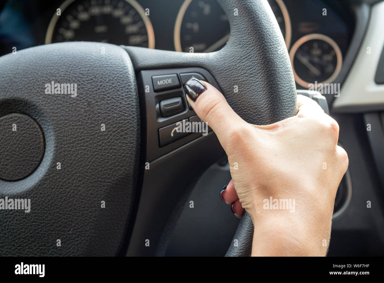 Car wheel hand of a young girl with a manicure Stock Photo - Alamy