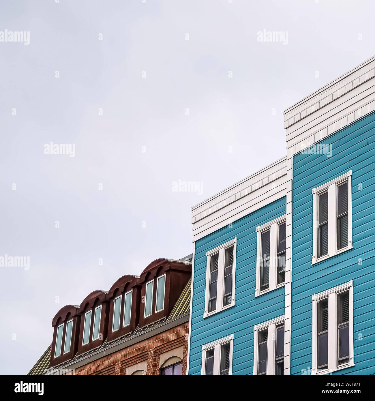 Square frame Residential building with blue exterior wall and vertical ...