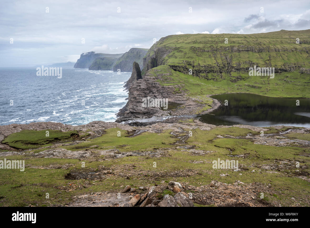 Cliffs at Lake Sorvagsvatn (Lake Leitisvatn) on Vagar Island in the ...