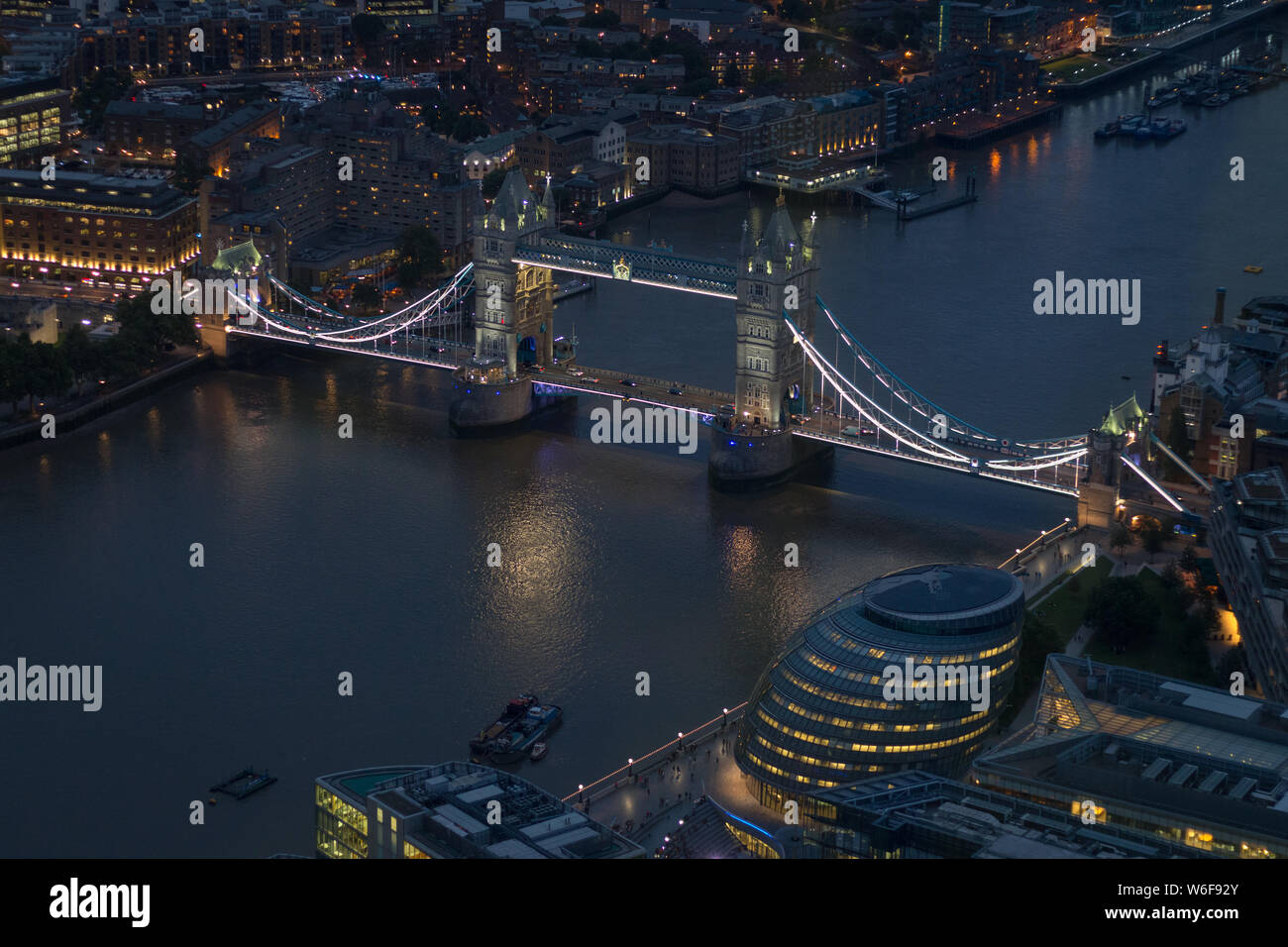 Aerial cityscape of London at night with urban architectures and Tower ...