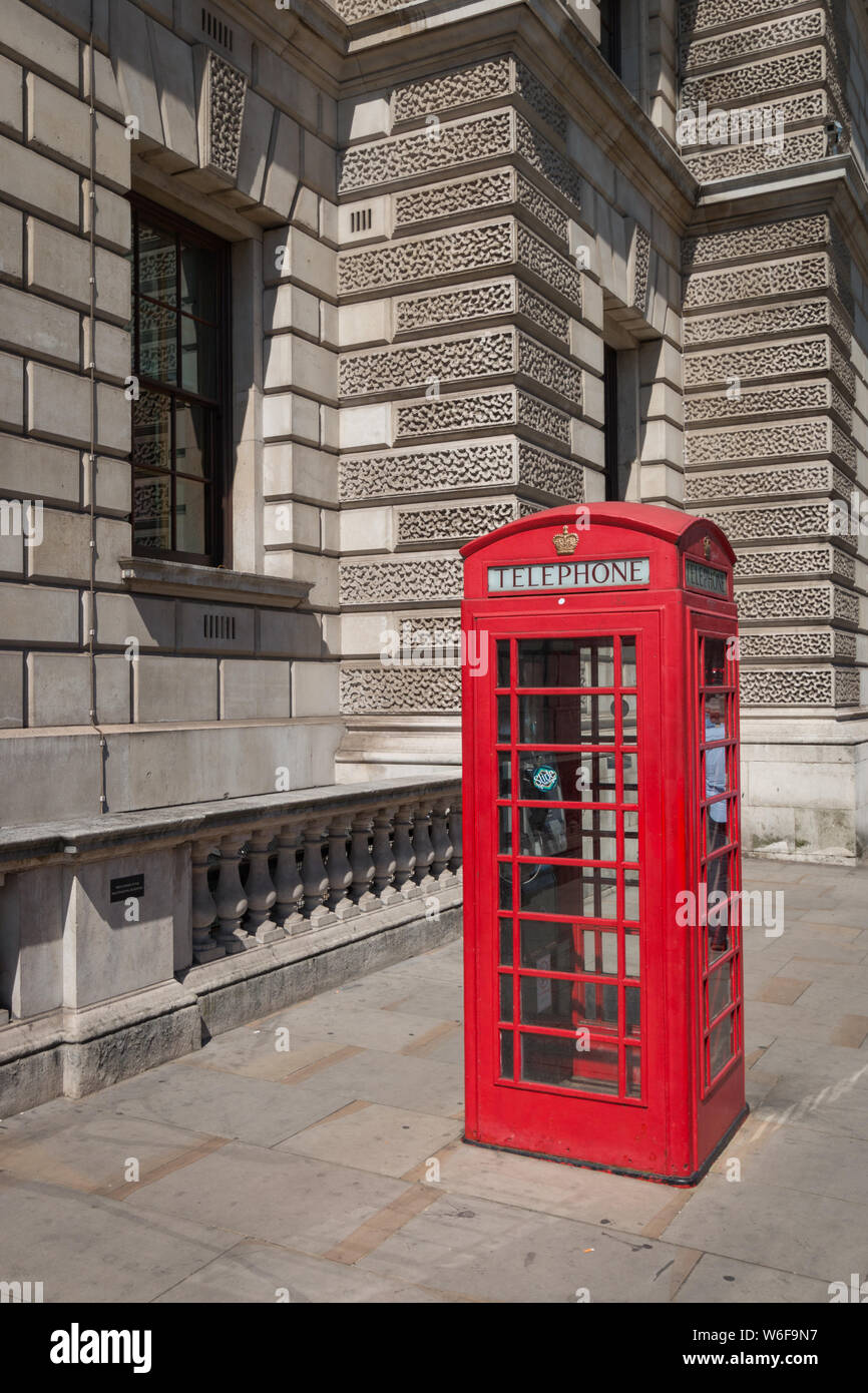 Classic and traditional red British telephone box in London, United ...