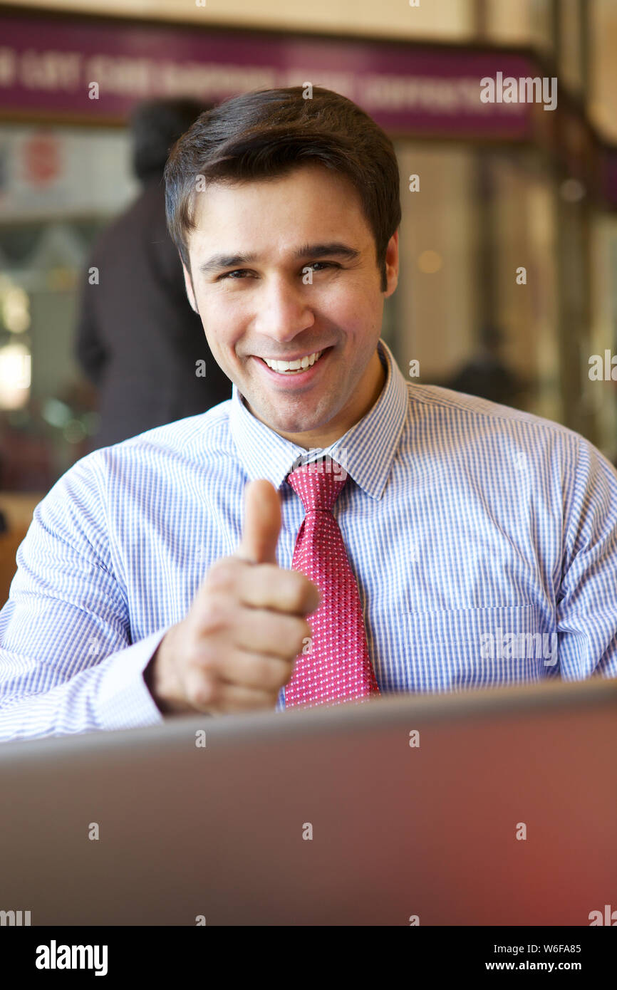 Businessman working computer thumbs up hi-res stock photography and ...
