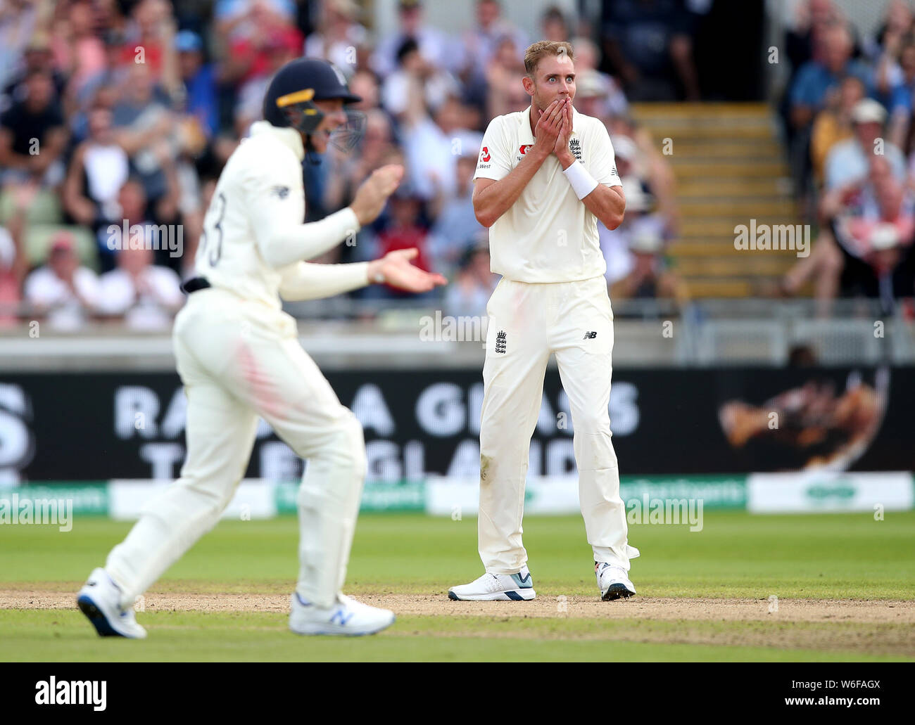 England's Stuart Broad celebrates taking the wicket of Australia's Tim ...