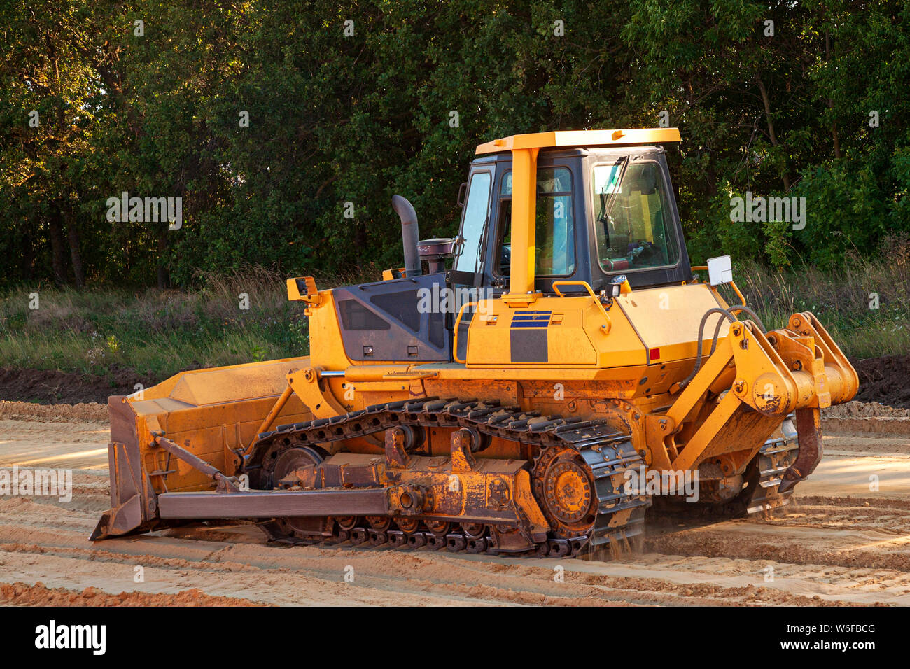 Bulldozer in action on a construction site Stock Photo - Alamy